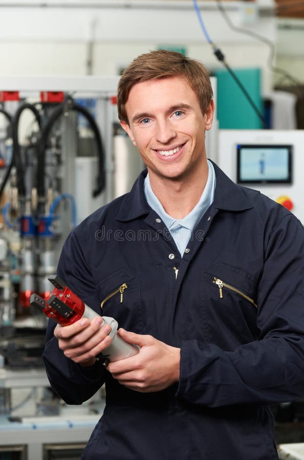 Engineer Holding Component in Factory Stock Photo - Image of ...