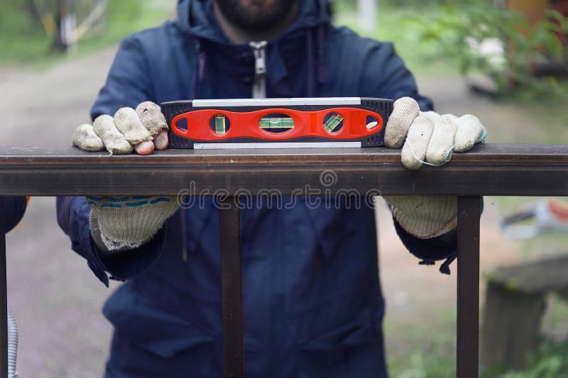 Engineer Holding a Level Ruler Stock Image - Image of liquid, outdoor ...