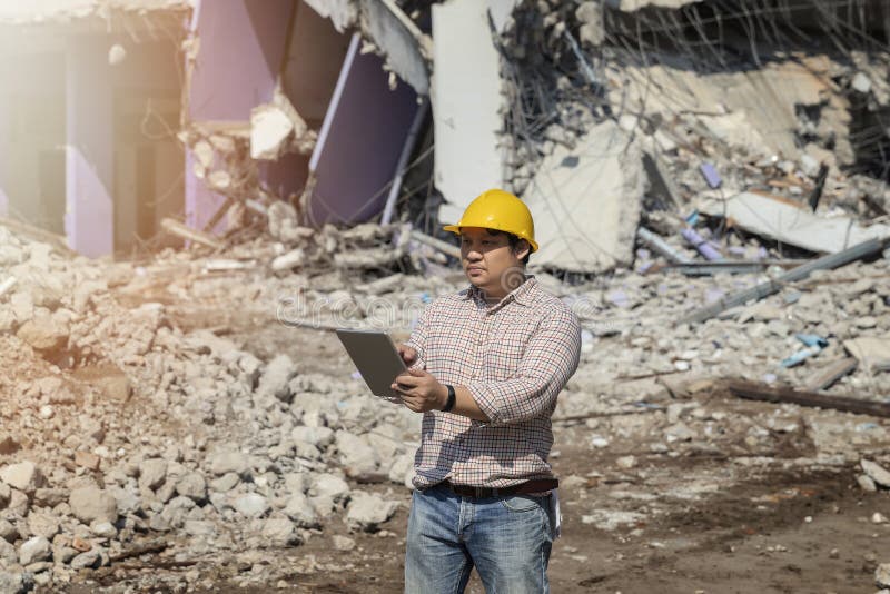 Engineer Holding Tablet is Checking for Destruction, Demolishing ...