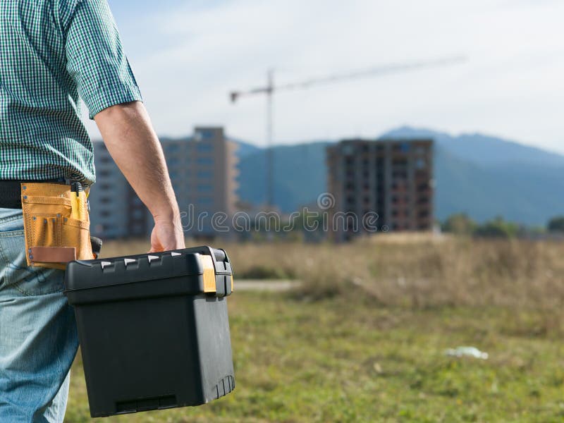 Engineer holding tool box stock photo. Image of engineering - 45341094