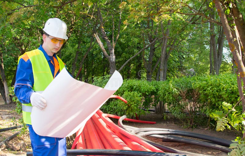 The Engineer Holds a Bundle of Paper, Communication Schemes for Laying ...