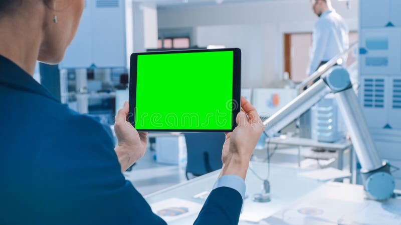 Engineer Holds Green Mock-up Screen Digital Tablet Computer. in the ...