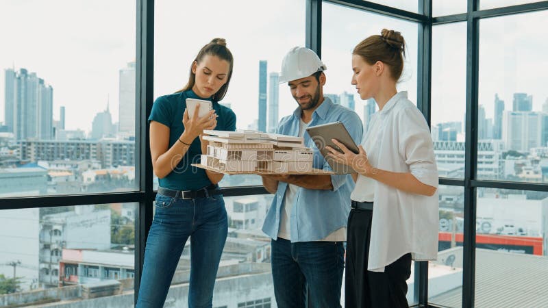 Engineer Holds House Model and Explain about House Construction ... Engineer Holds House Model and Explain about House Construction ...