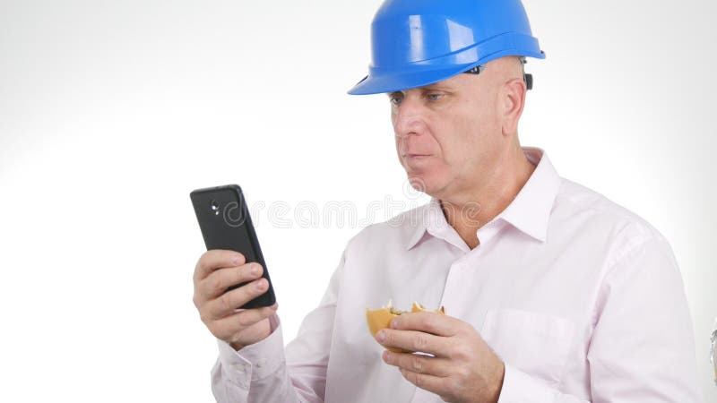 Engineer Image Eat a Sandwich and Text Using Cellphone Stock Image ...