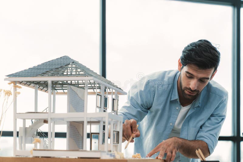 Engineer Inspect House Model while Using Pencil Pointing at Structure ...