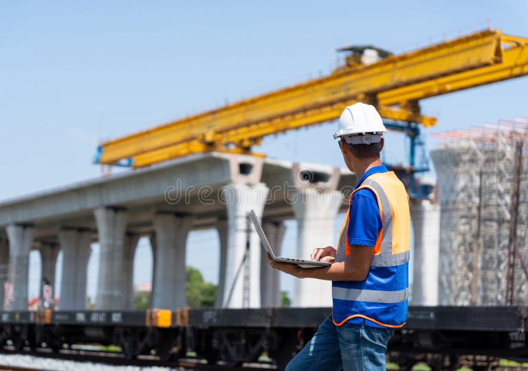 Engineer Inspecting Bridge Construction with Laptop, Foreman Worker ...