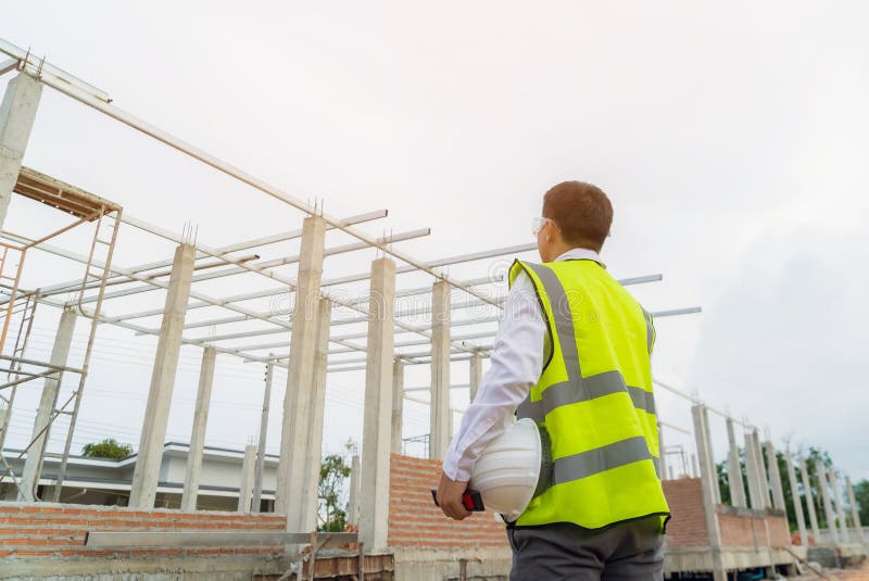 Engineer Inspecting the House Structure Stand with Your Back on Your ...