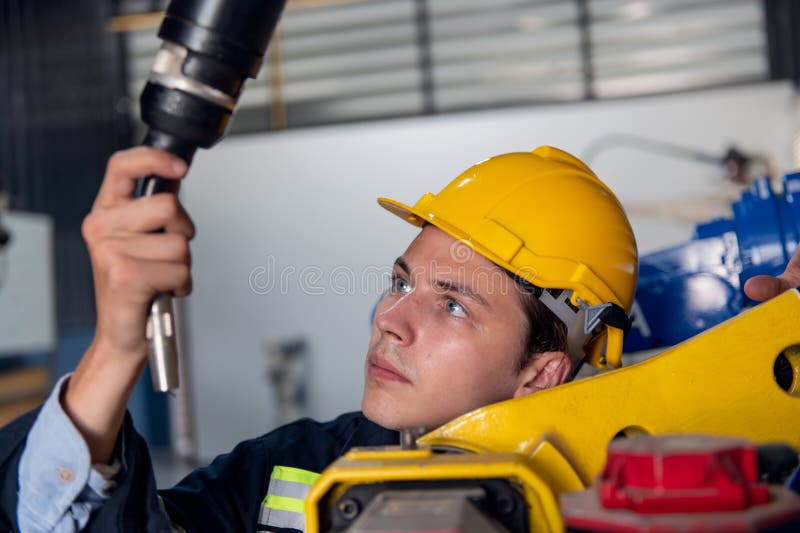 Engineer Inspection Control a Robot Arm Welding Machine with a Remote ...