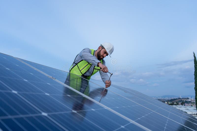 Engineer Installing and Giving Maintenance To Solar Panels, Concept of ...