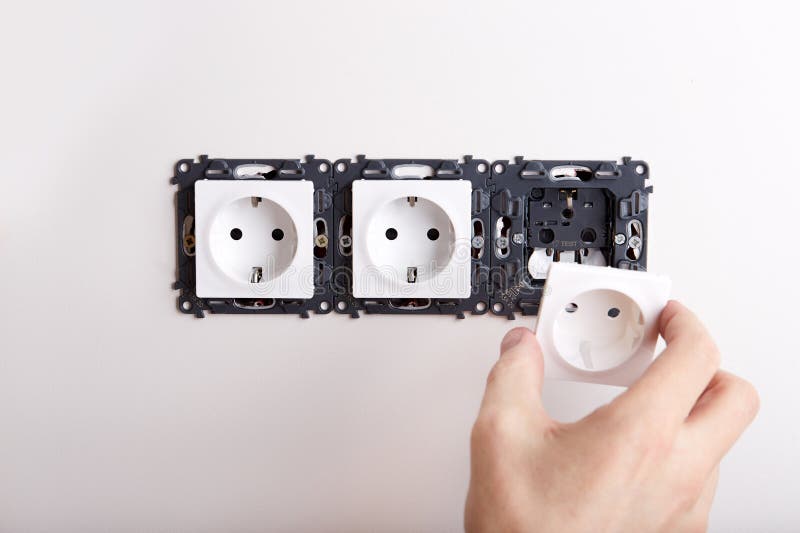 An Engineer is Installing New Sockets during the Renovation. Stock ...