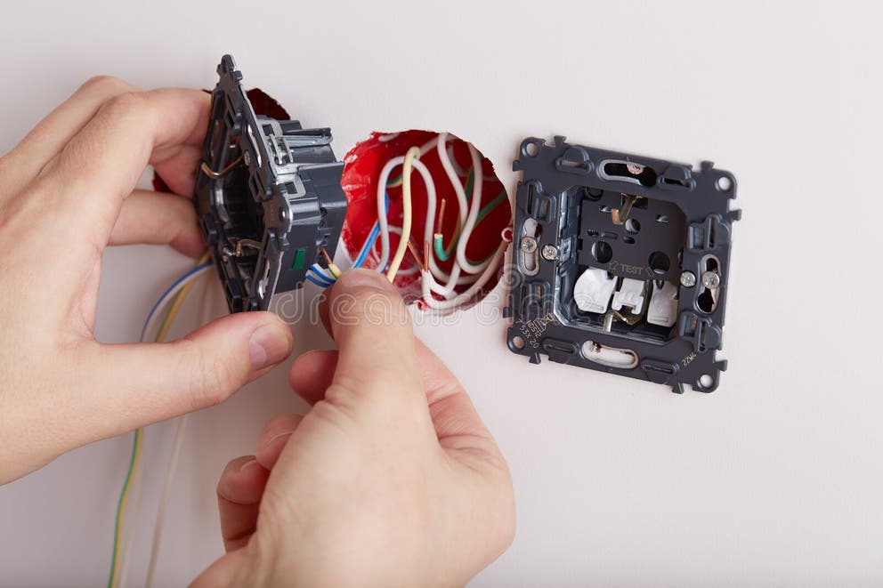 An Engineer is Installing New Sockets during the Renovation. Stock ...