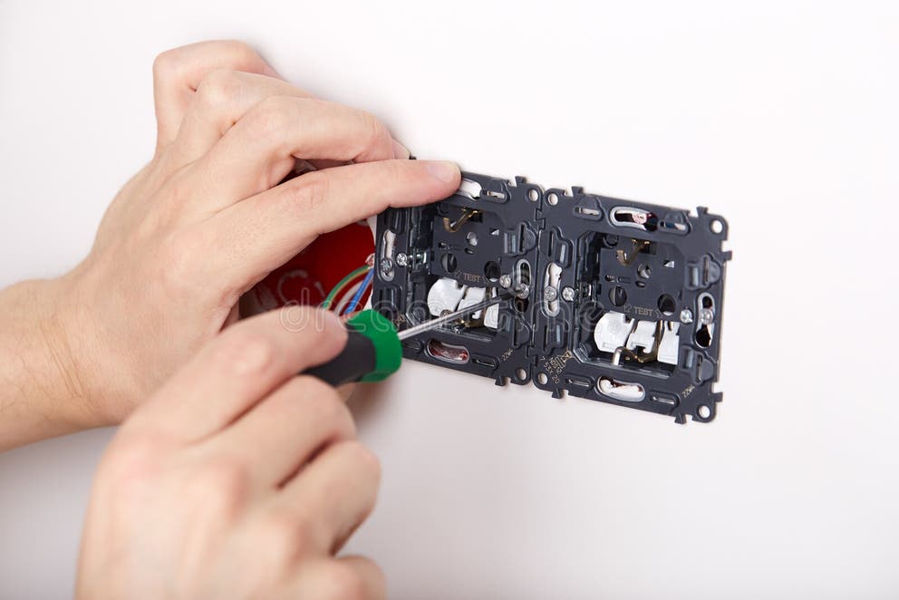 An Engineer is Installing New Sockets during the Renovation. Stock ...