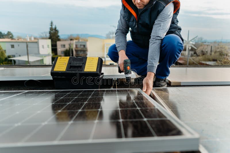 Engineer Installing Solar Photovoltaic Panel System Using Screwdriver ...