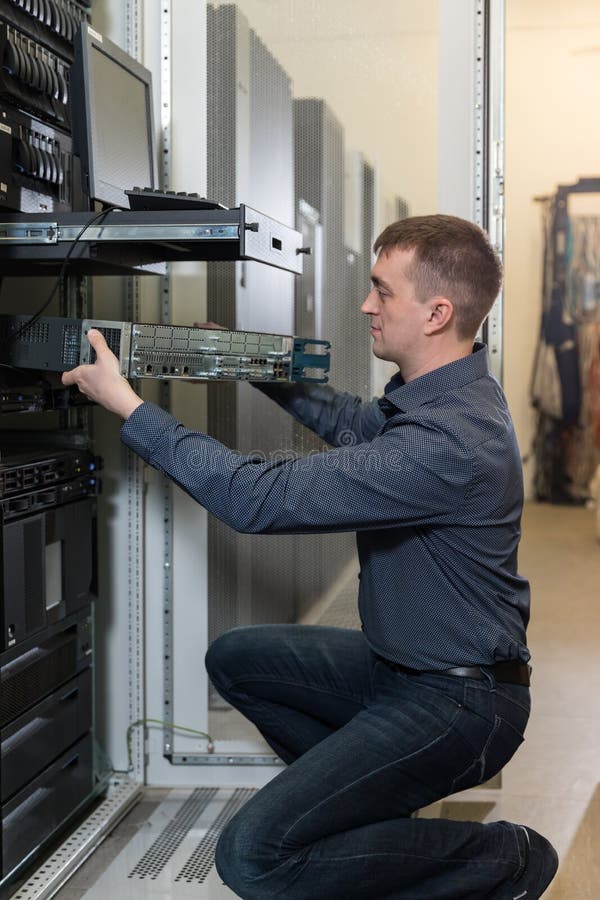 It Engineer Installs Equipment To Rack in Datacenter Stock Image ...