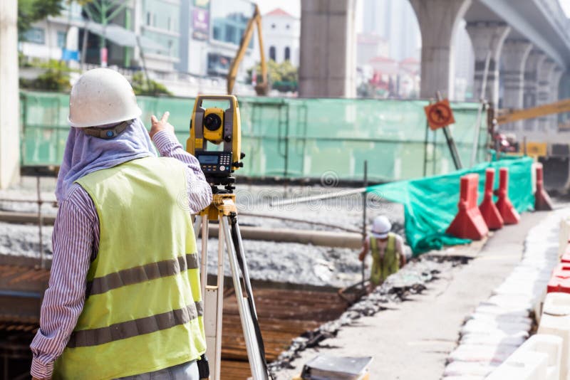 Engineer Instructing while Operating Dumpy Automatic Level Instr ...