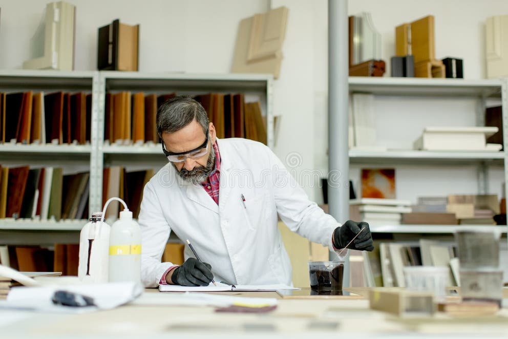 Engineer in the Laboratory Examines Ceramic Tiles Stock Photo - Image ...