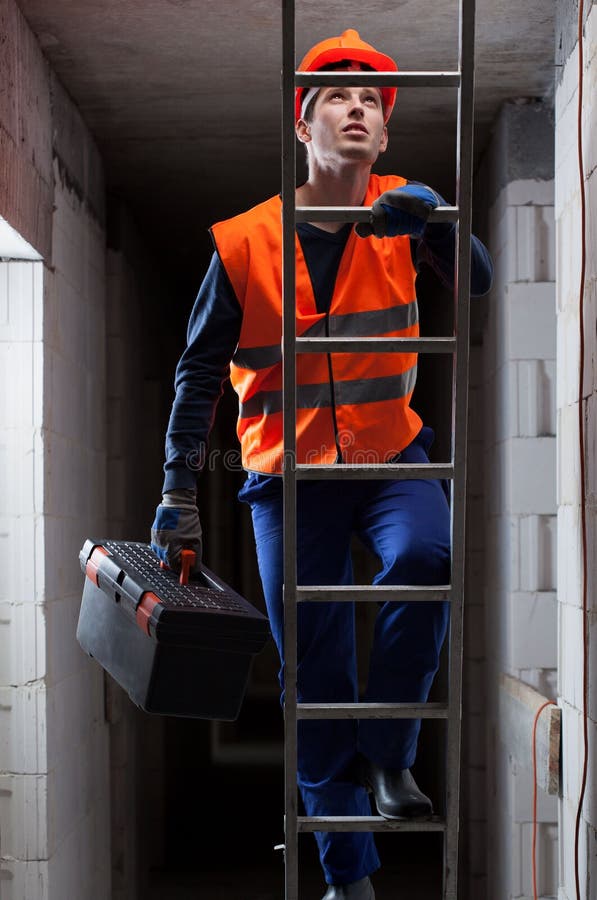 Workman climbing a ladder stock image. Image of climbing - 6269013