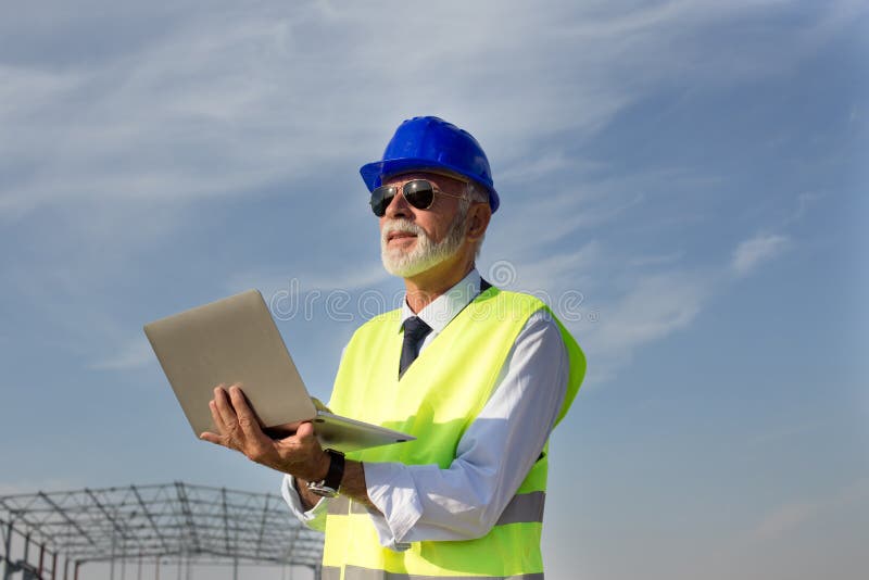 Engineer with Laptop at Building Site Stock Image - Image of helmet ...