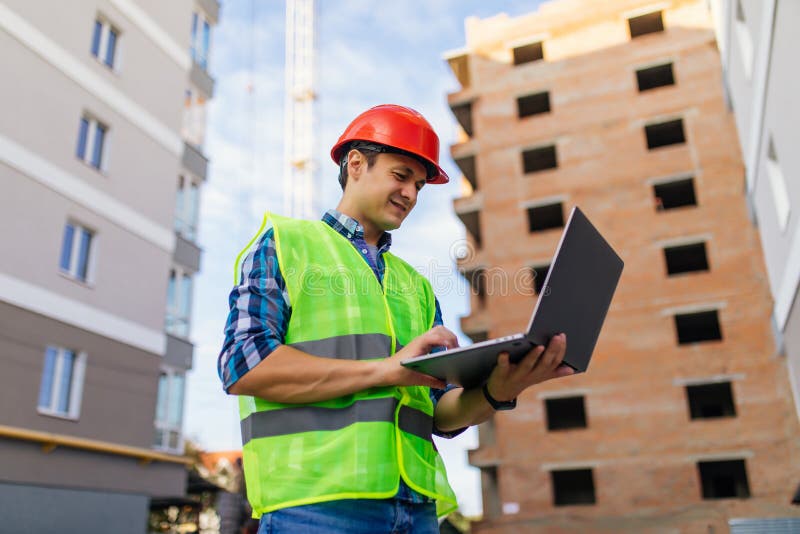 Engineer Builder with Laptop Computer at Construction Site Stock Photo ...