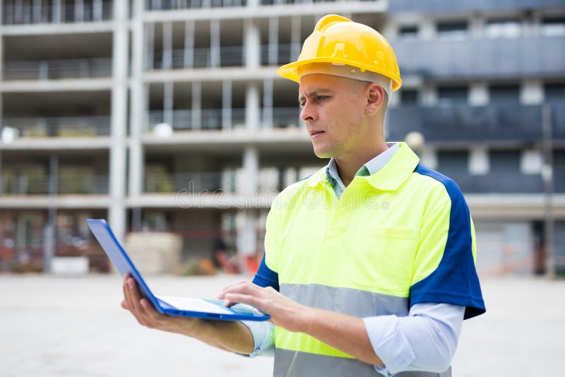 Engineer with Laptop in Construction Site Stock Image - Image of ...