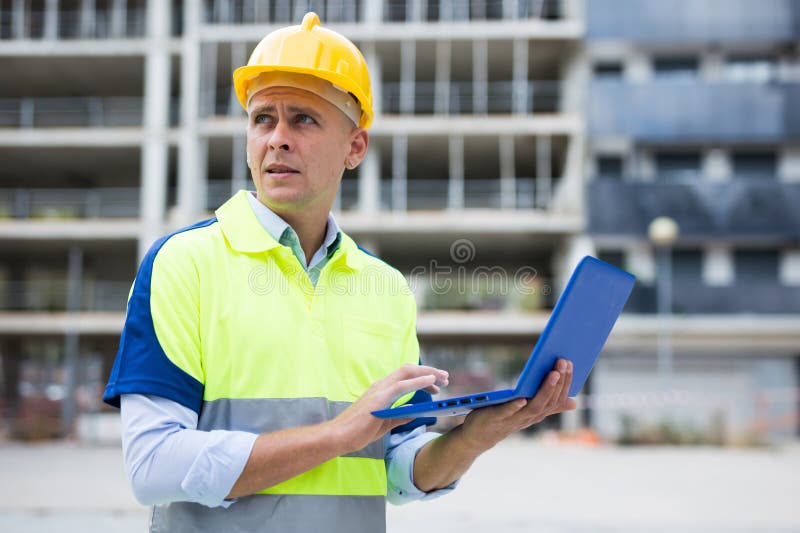Engineer with Laptop in Construction Site Stock Image - Image of helmet ...