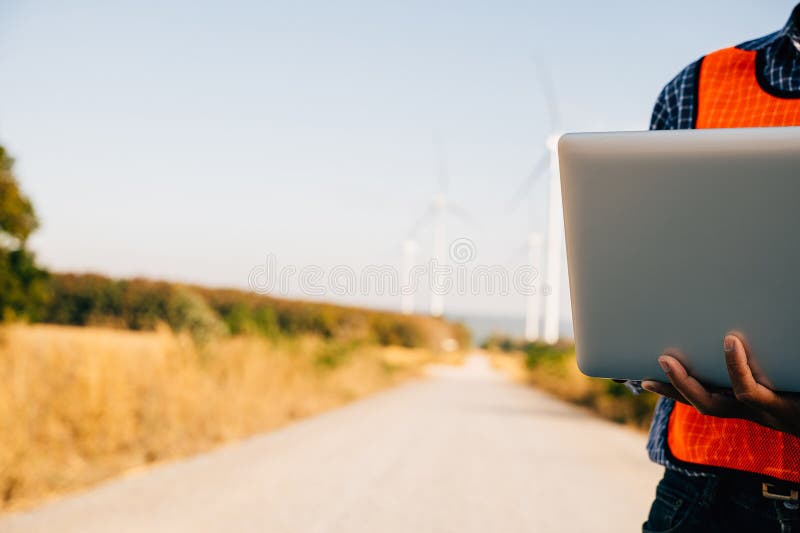 Engineer with Laptop by Wind Turbines Stock Image - Image of mill, hand ...