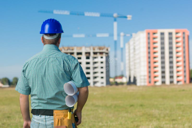 Engineer Looking at Building in Construction Stock Photo - Image of ...