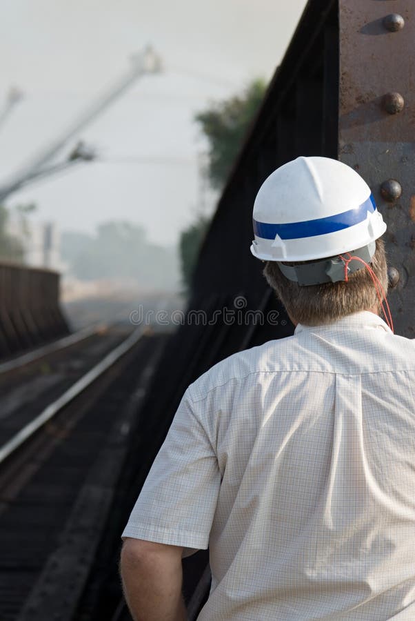 Engineer Looking Down Track Stock Image - Image of observing, engineer ...