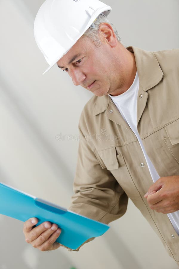 Engineer looking at folder stock image. Image of repair - 205719065