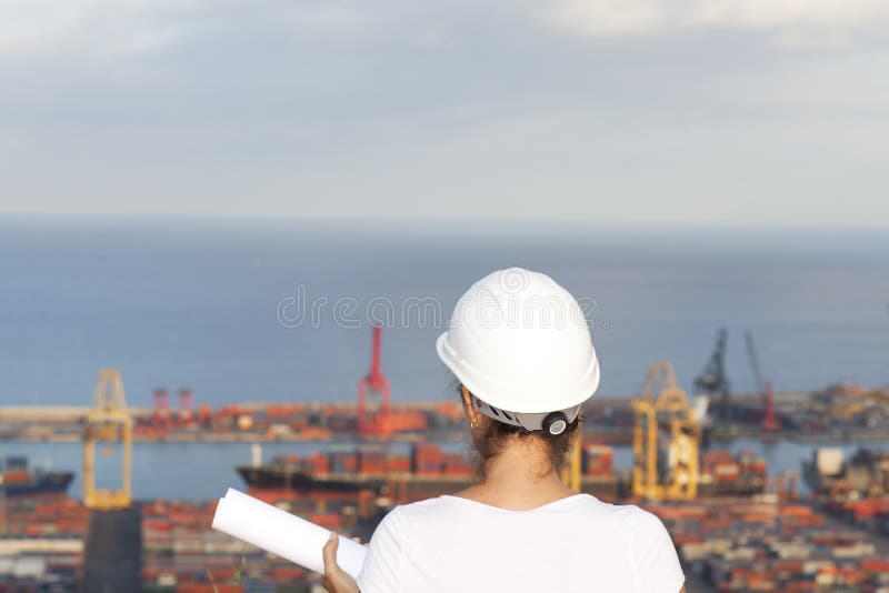 Engineer looks at port stock photo. Image of drawing - 20757344