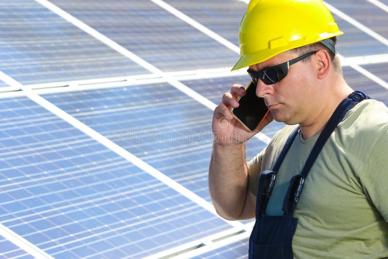 Engineer is Make Call with a Mobile Phone in Solar Power Plant Stock ...