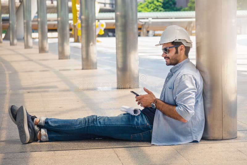 Engineer Male with Chief Engineer Cap Sitting on Pathway at Outside ...