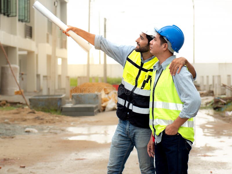 Engineer Man and Architect, Contractor Wear Safety Helmets Discuss ...