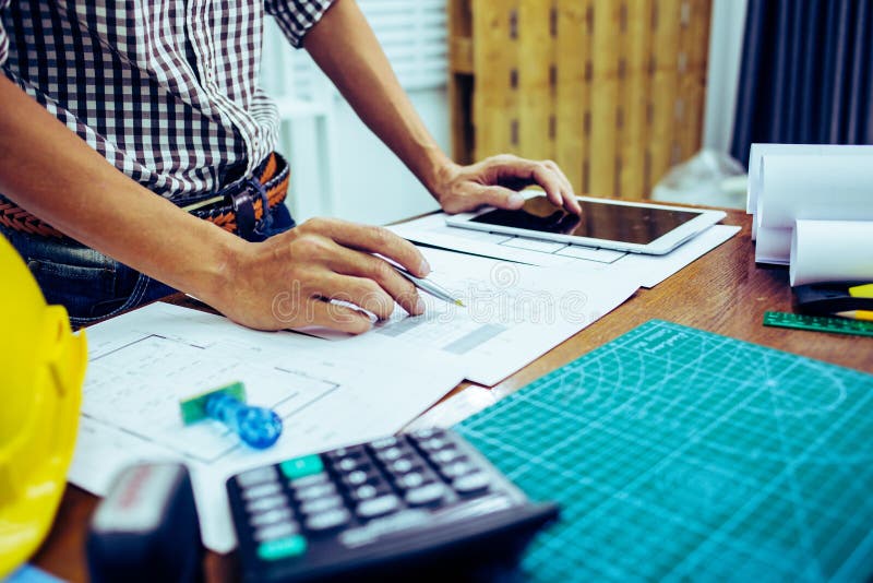 Engineer Man and Architect Drawings Blueprint at Construction Site.Home ...