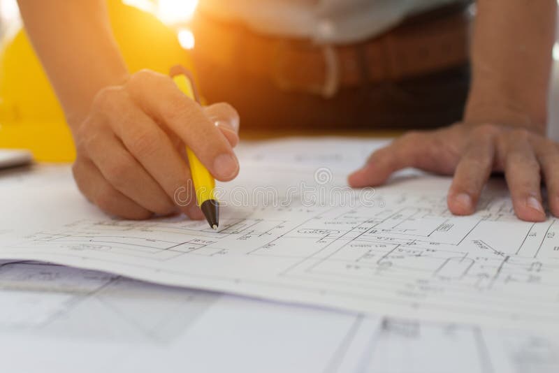 Engineer Man and Architect Drawings Blueprint at Construction Site.Home ...