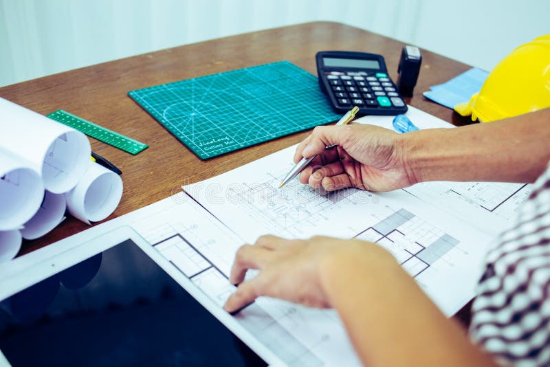 Engineer Man and Architect Drawings Blueprint at Construction Site.Home ...