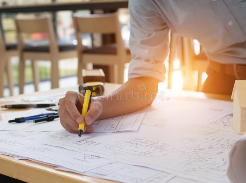 Engineer Man and Architect Drawings Blueprint at Construction Site.Home ...