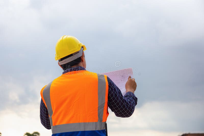 Engineer Man with Blueprint Checking Project at Building Site, Foreman ...