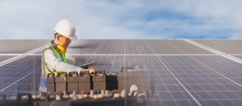 Engineer Man Checking of the Battery Storage System with Solar Panels ...