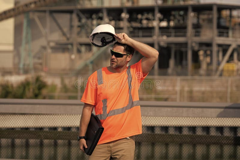 Engineer Man at Construction Site Outdoor. Photo of Engineer Man at ...
