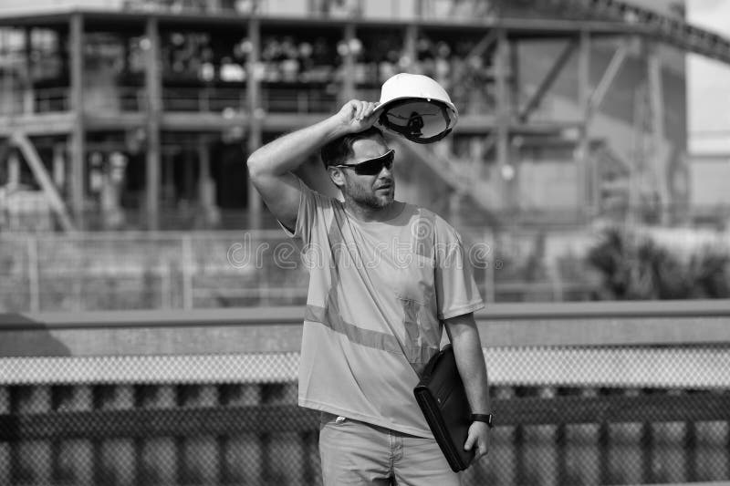 Engineer Man at Construction Site Outdoor. Photo of Engineer Man at ...