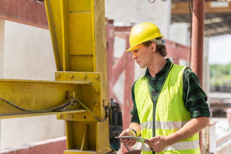 Engineer Man with Digital Tablet Checking Project in the Precast Concrete Factory Site, Foreman ...
