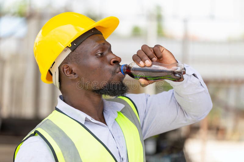 Engineer Man Drinking Water at the Precast Factory Site, Worker Man ...