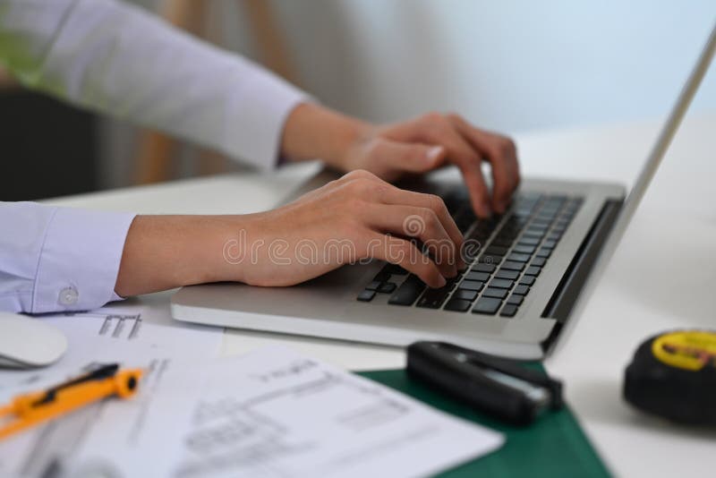 Engineer Hands Typing on Laptop Computer while Working on Construction ...
