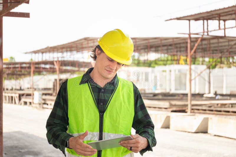 Engineer Man in Hardhats with Tablet on Construction Site, Foreman ...