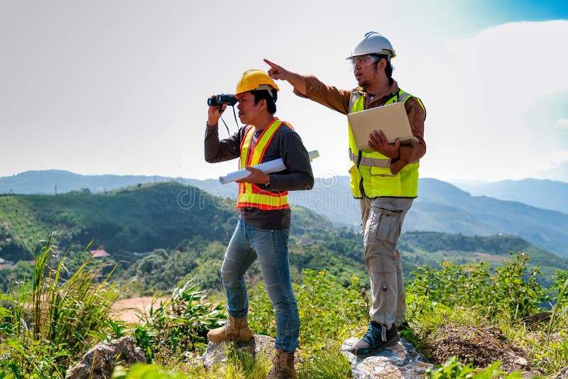 Engineer Man with Laptop Point To Forward Direction while His Team Use ...