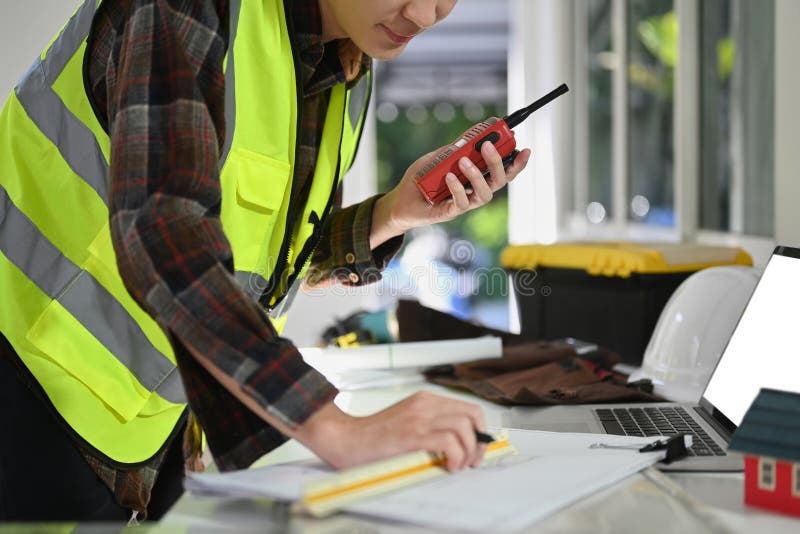 Engineer Man Standing Communicating with Walkie Talkie and Working with ...