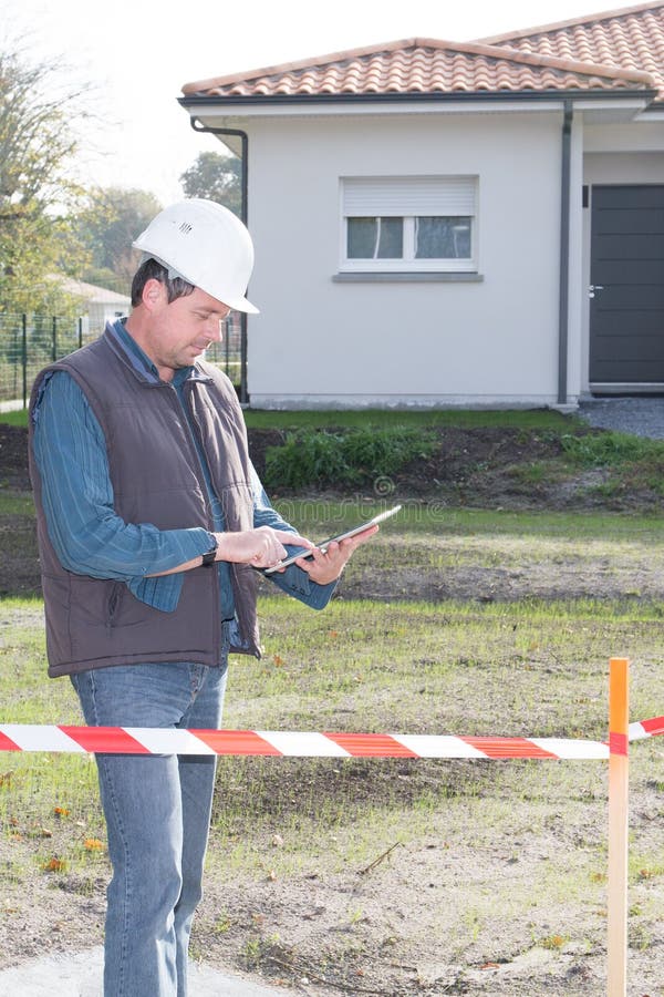 Man with Tablet Outdoor in House Construction Site Stock Photo - Image ...