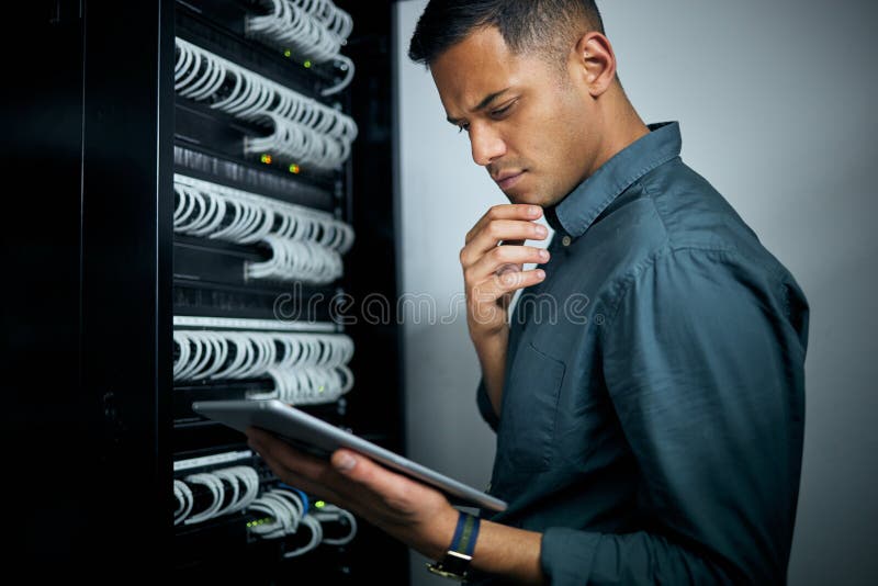 Engineer Man Tablet And Thinking In Server Room Inspection Coding And Check For Analysis