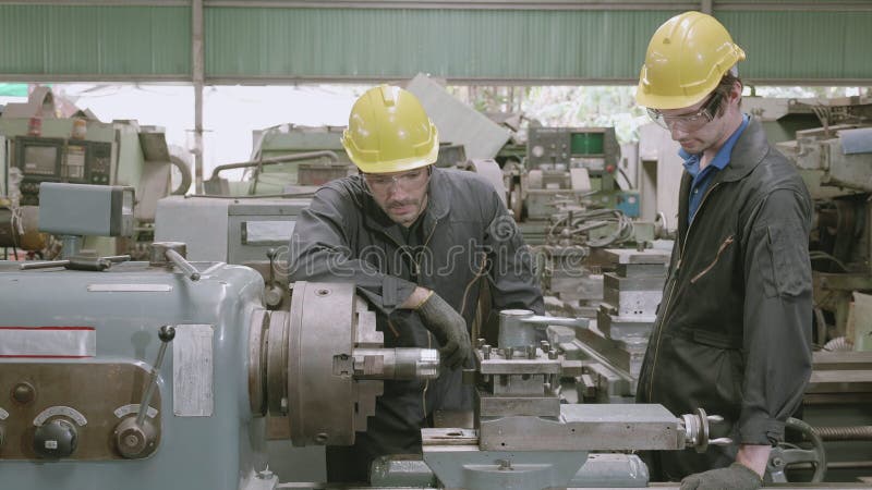 Engineer Man Training with Foreman for Apprentice Using Lathe ...